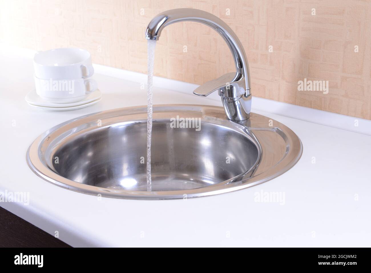 Water tap and sink in modern kitchen Stock Photo - Alamy