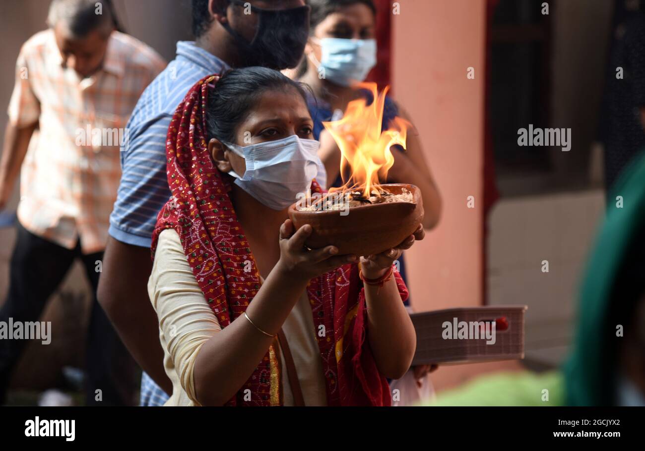 Guwahati, Guwahati, India. 9th Aug, 2021. Devotees offer prayer during ...