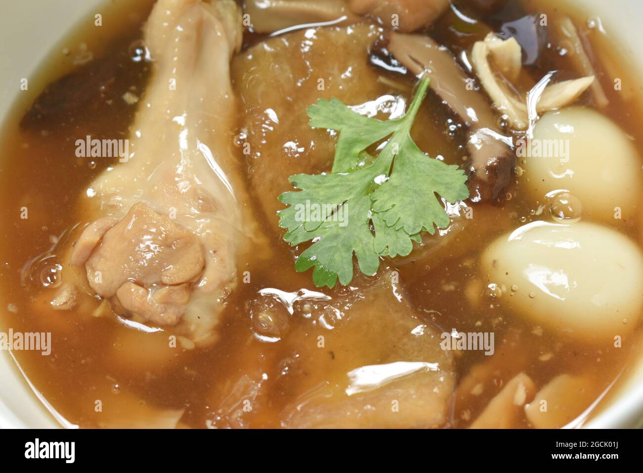 braised fish maw with bamboo shoot topping slice chicken and boiled egg ...