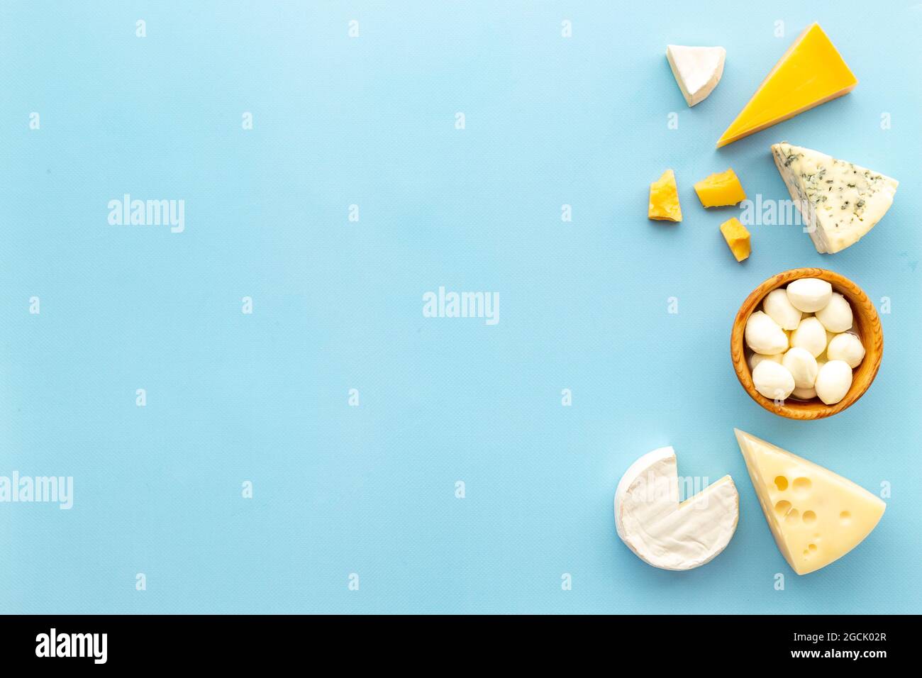 Various types of cheese layout. Dairy products flat lay Stock Photo - Alamy
