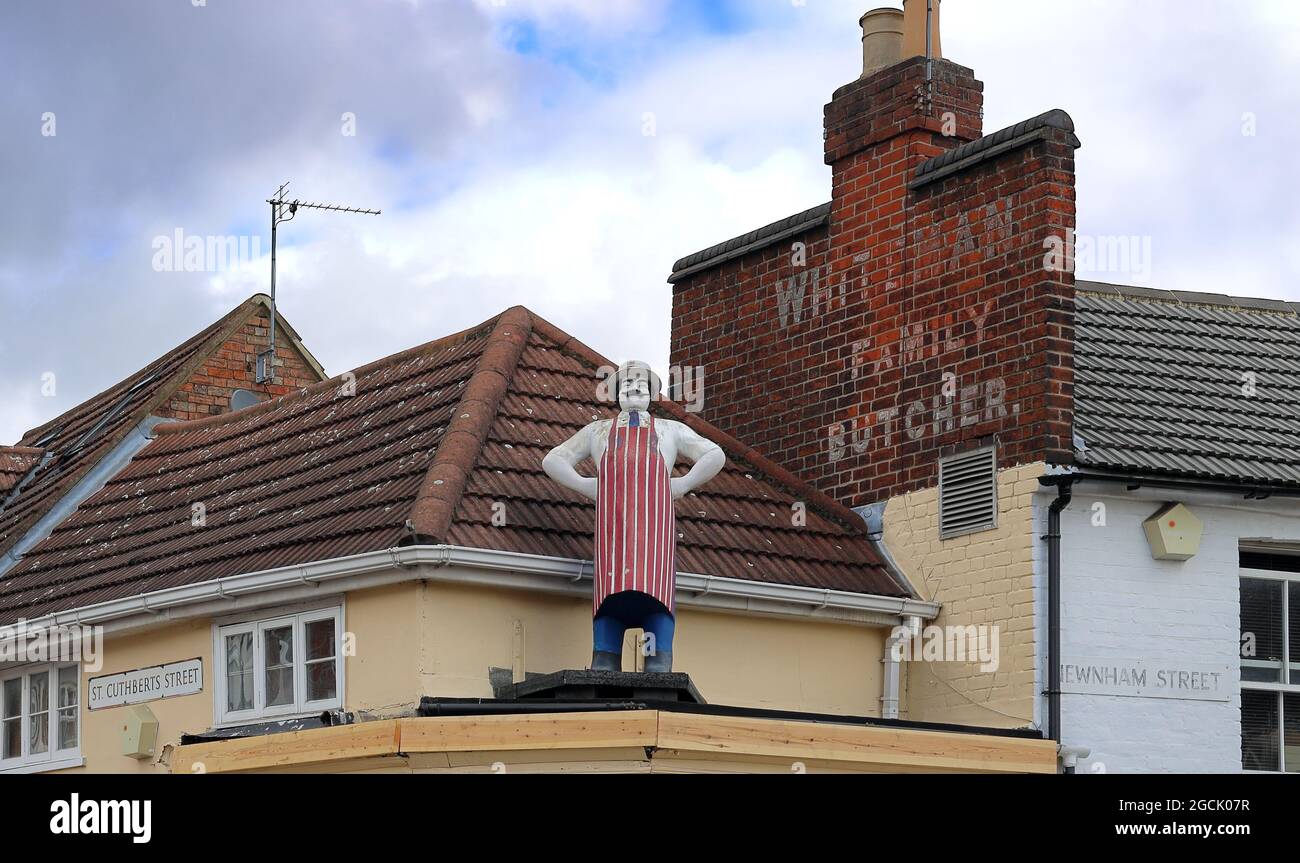 Statue of butcher above butchers shop at corner of St Cuthberts Street ...