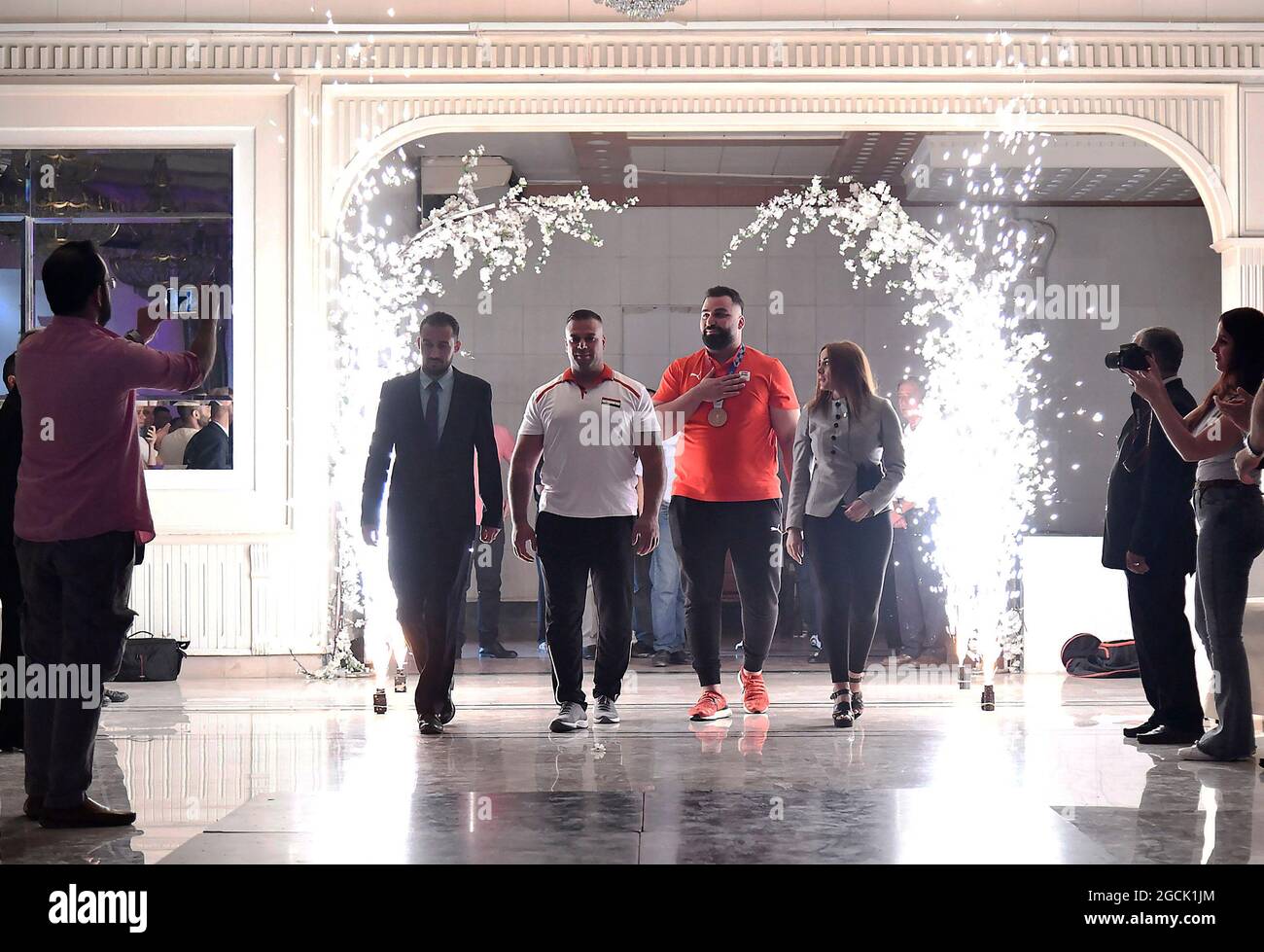 SYRIA, Aug. 9, 2021 (Xinhua) -- Syrian weightlifter Man Asaad (4th R ...