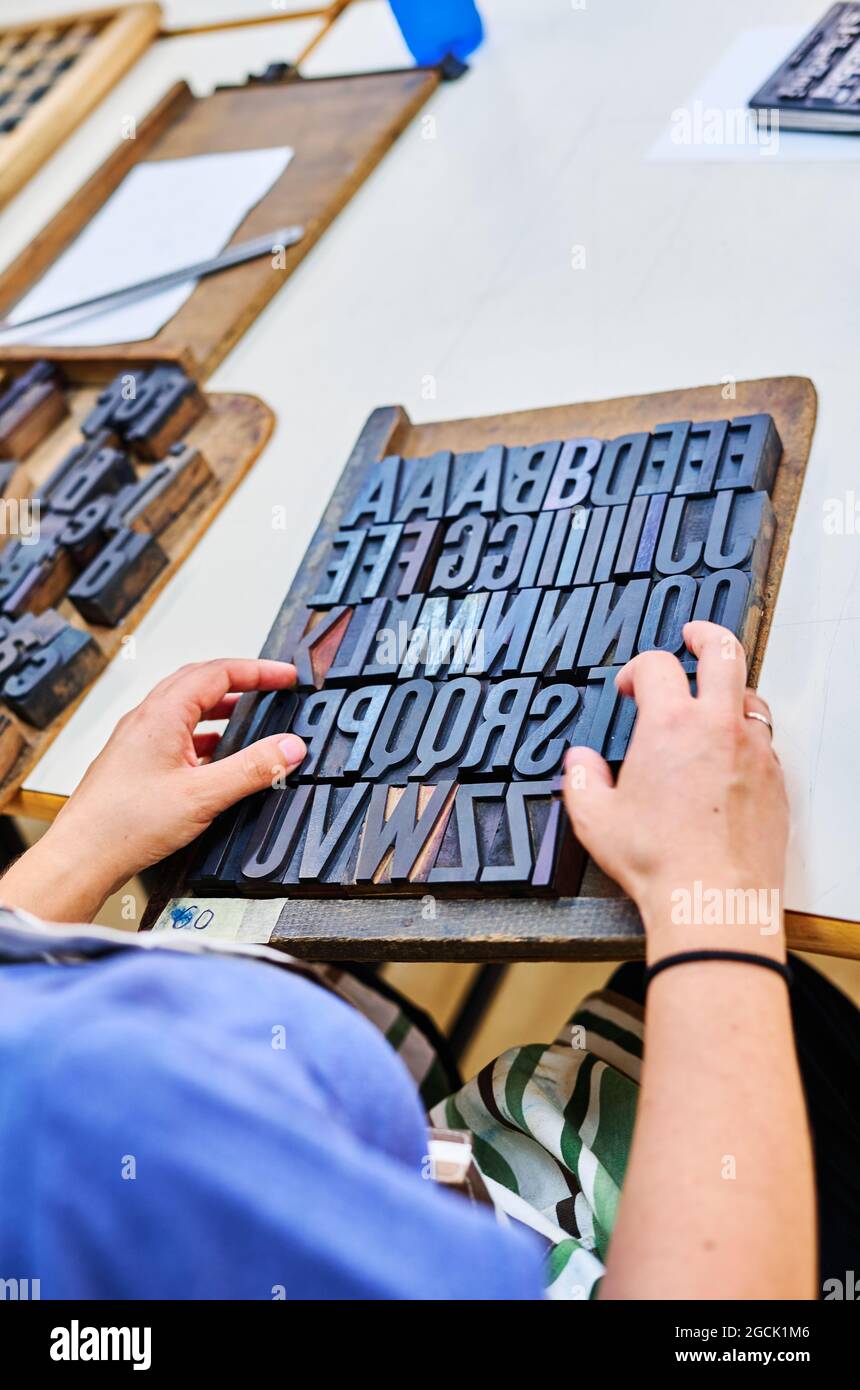 From Above Of Anonymous Male Worker Working With Letterpress Alphabet