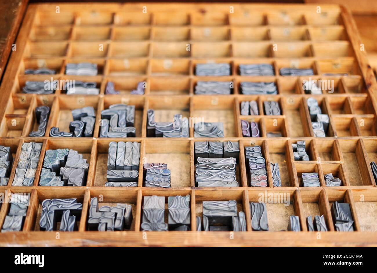 Set of metal shabby letterpress symbols and adorn images placed in ...