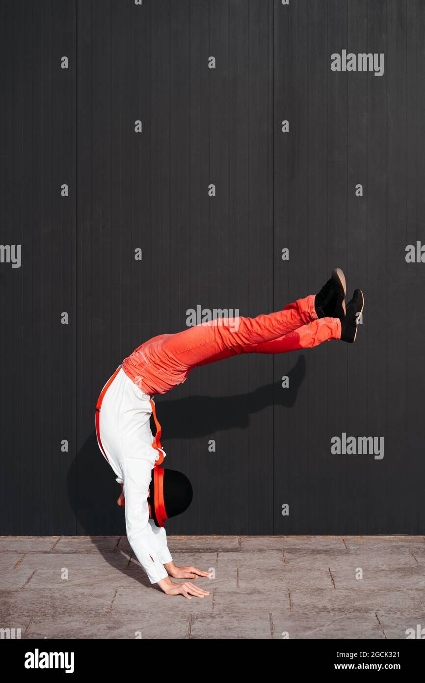 Side view of unrecognizable agile male circus performer doing ...