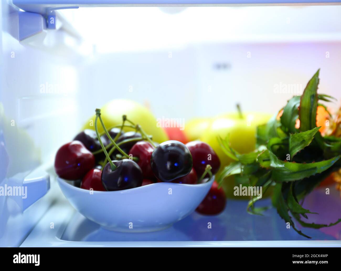 Fresh fruits on shelves in refrigerator Stock Photo - Alamy