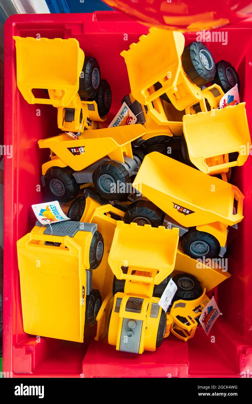 children's colourful plastic beach toys yellow diggers in a box in ...