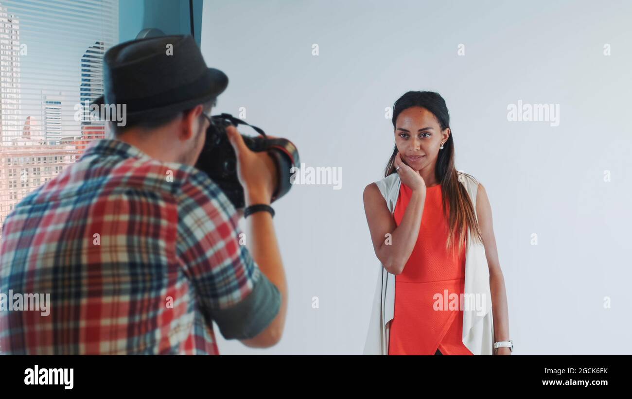 Backside view of photographer taking photo of beautiful multiracial ...
