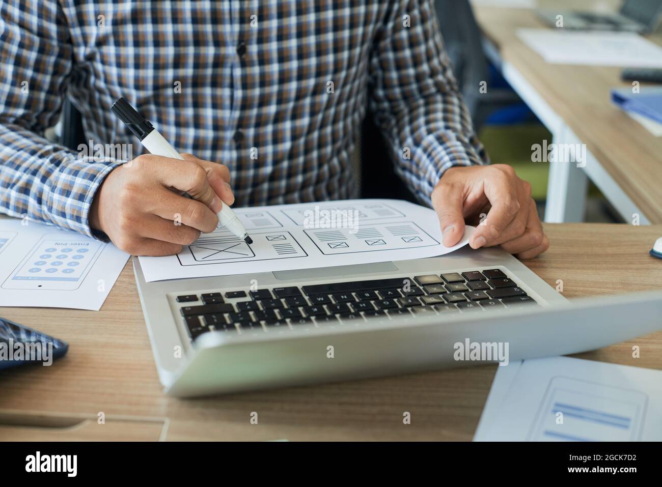 Close-up image of professional UI designer drawing sketch of interface ...