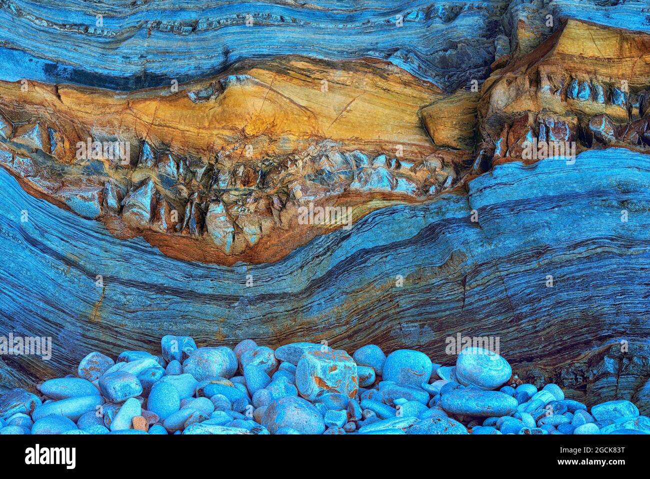 Textured background of solid rocky surface with layers of blue and ...