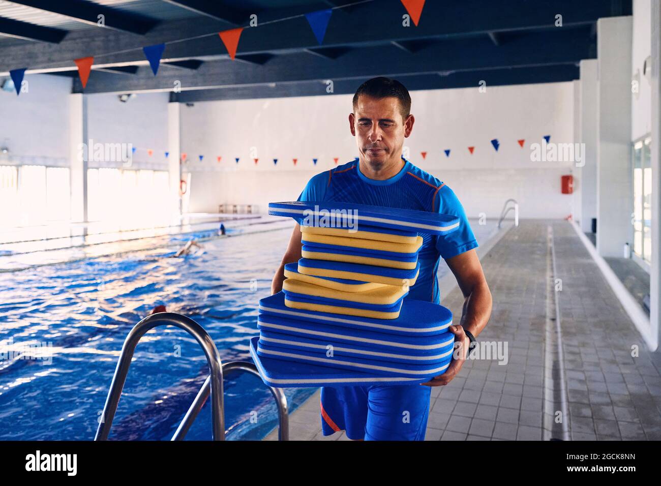 Cool female in street style outfit smoking e cigarette and exhaling ...