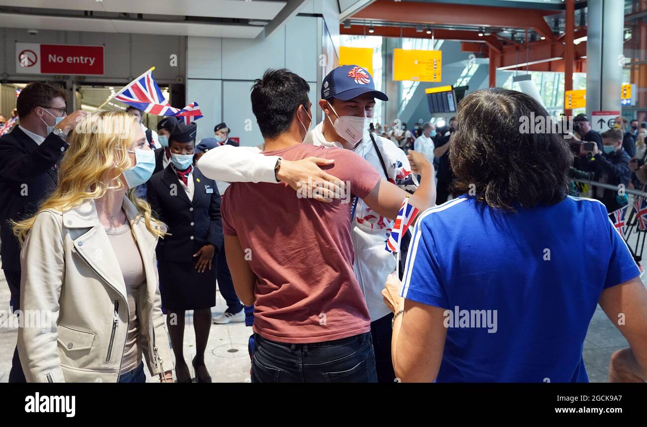 Great Britain's Joe Choong is greeted as he arrives at Heathrow Airport ...
