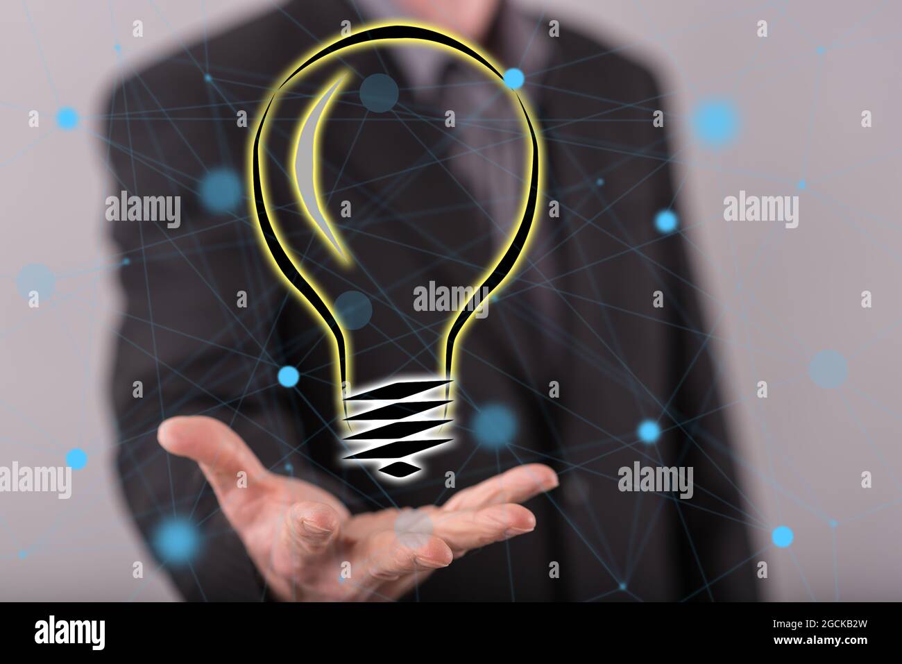 Bright idea concept above the hand of a man in background Stock Photo ...