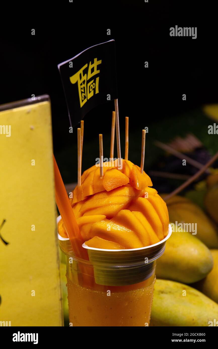 Fresh cut mango cup on a night market in Malacca, Malaysia Stock Photo ...