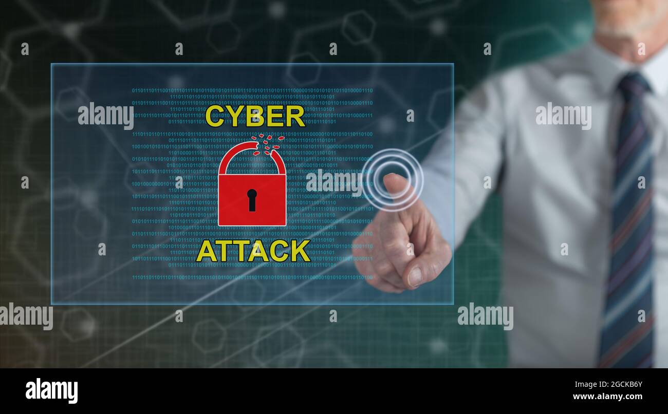 Man touching a cyber attack concept on a touch screen with his finger ...