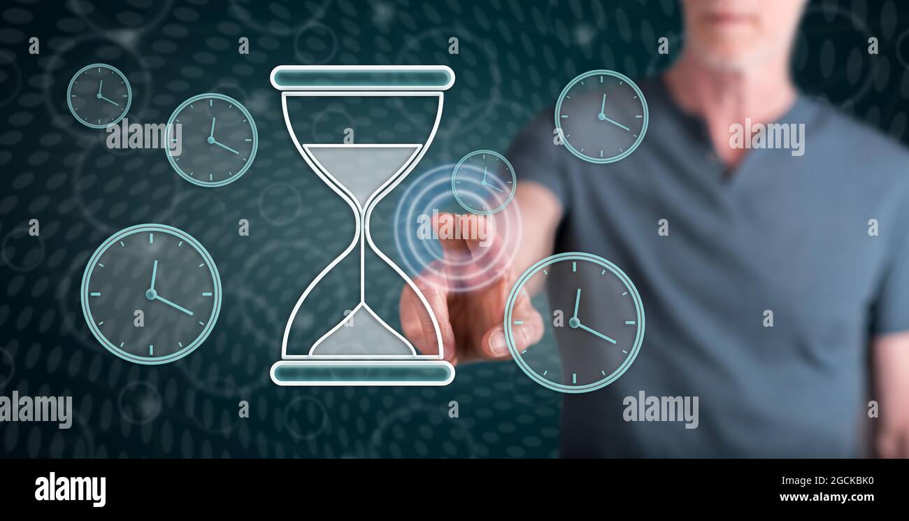 Man touching a time management concept on a touch screen with his ...