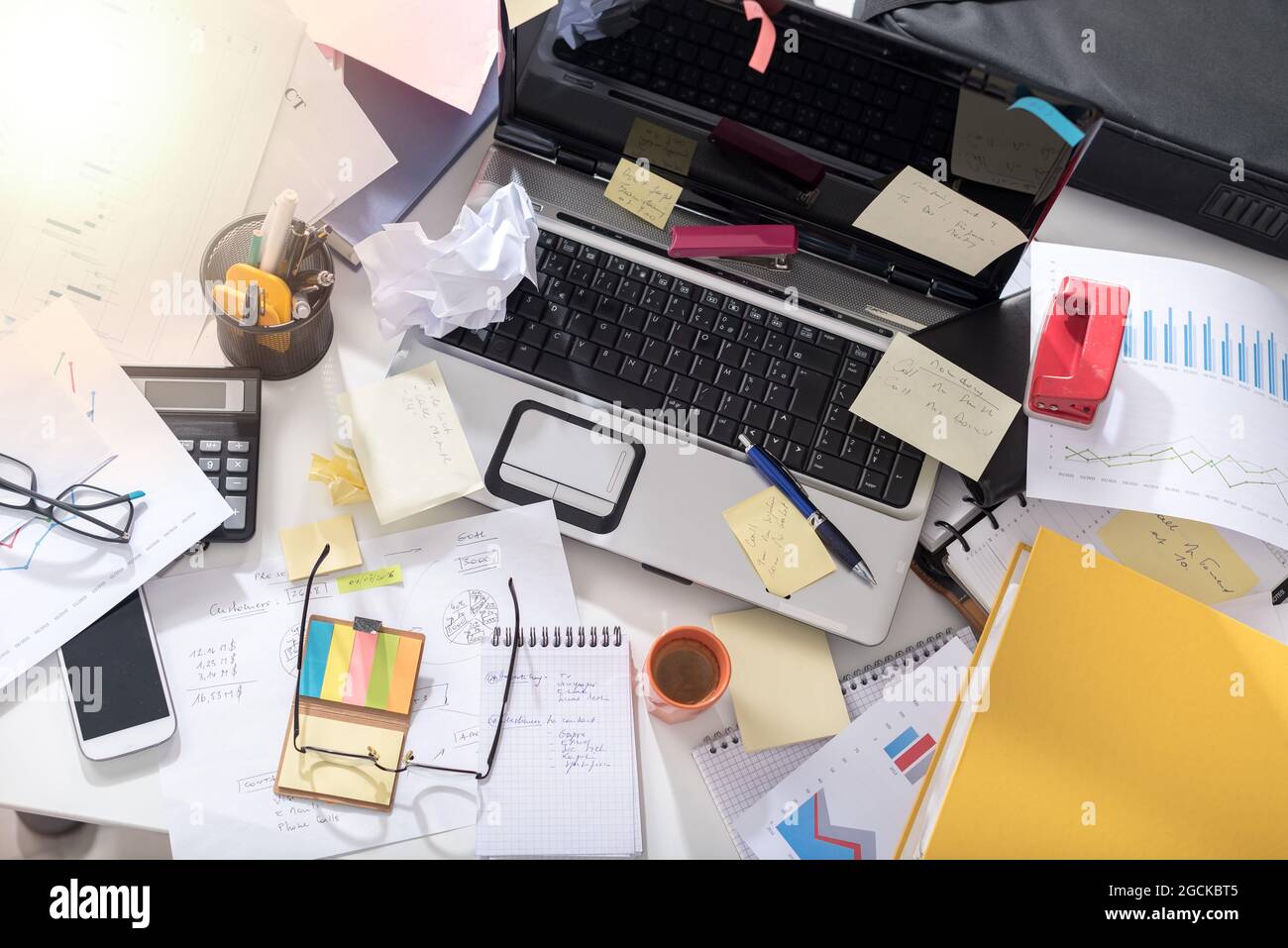 Messy and cluttered office desk, light effect Stock Photo - Alamy