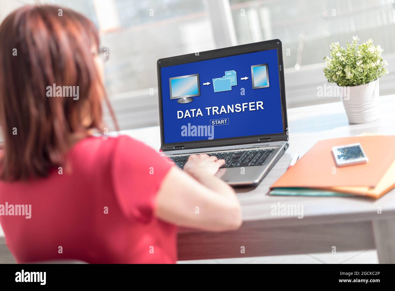 Laptop screen displaying a data transfer concept Stock Photo - Alamy