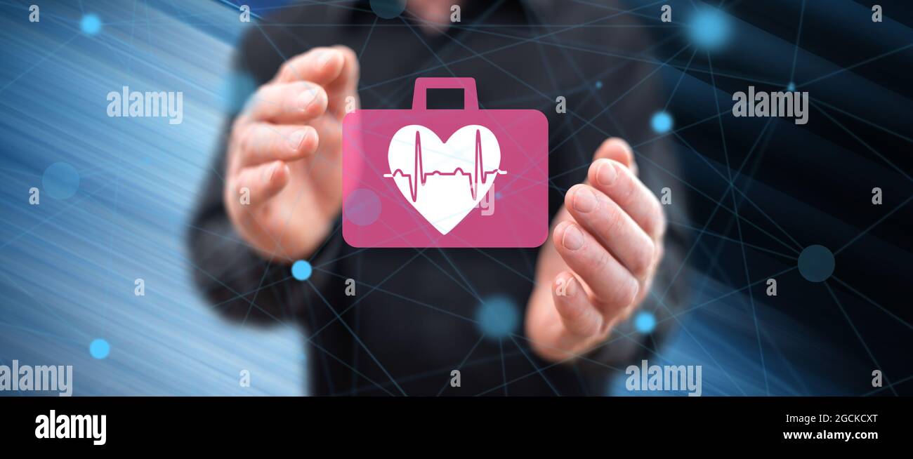 Cardiac emergency concept between hands of a man in background Stock ...