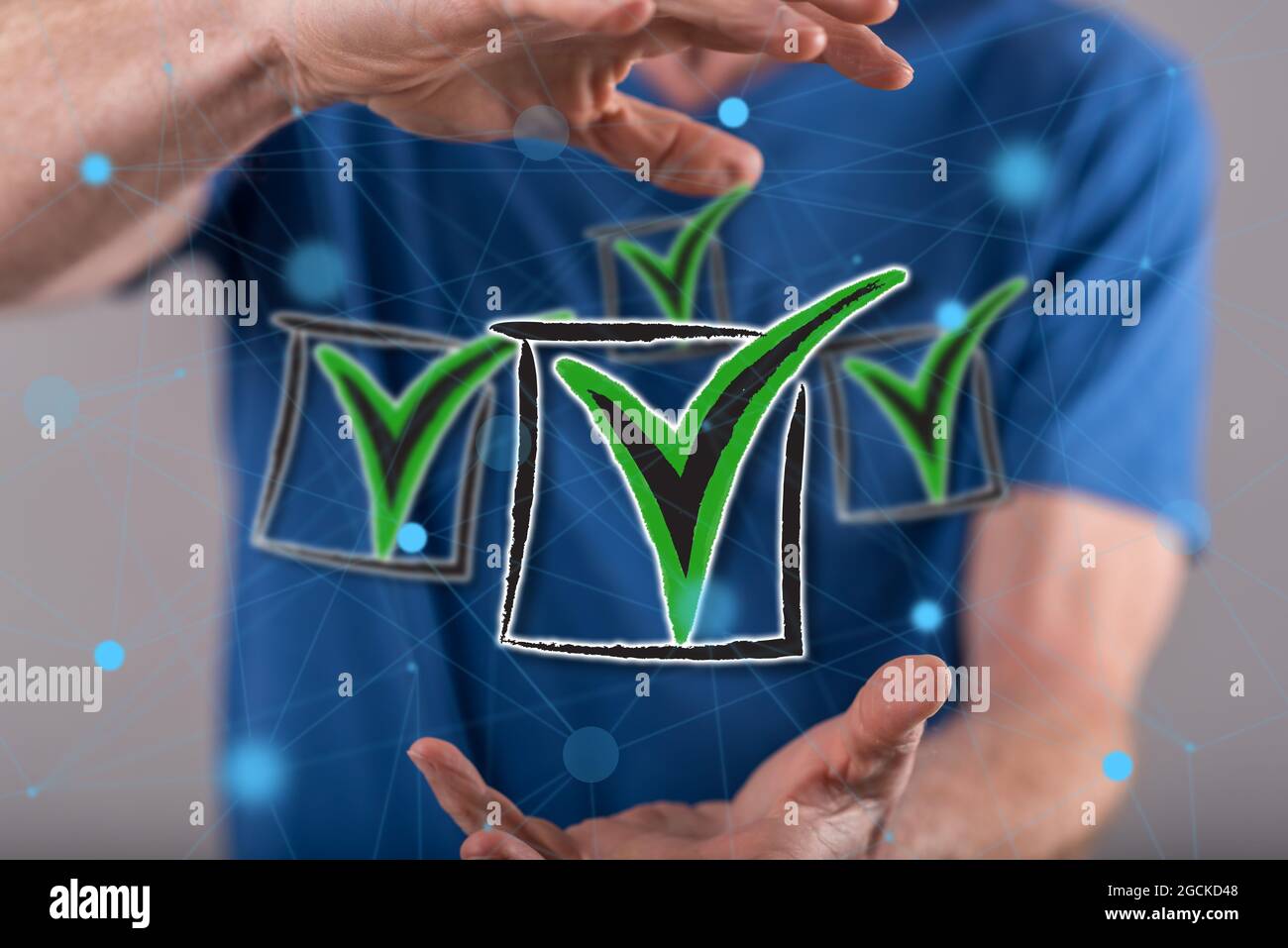 Validation concept between hands of a man in background Stock Photo - Alamy