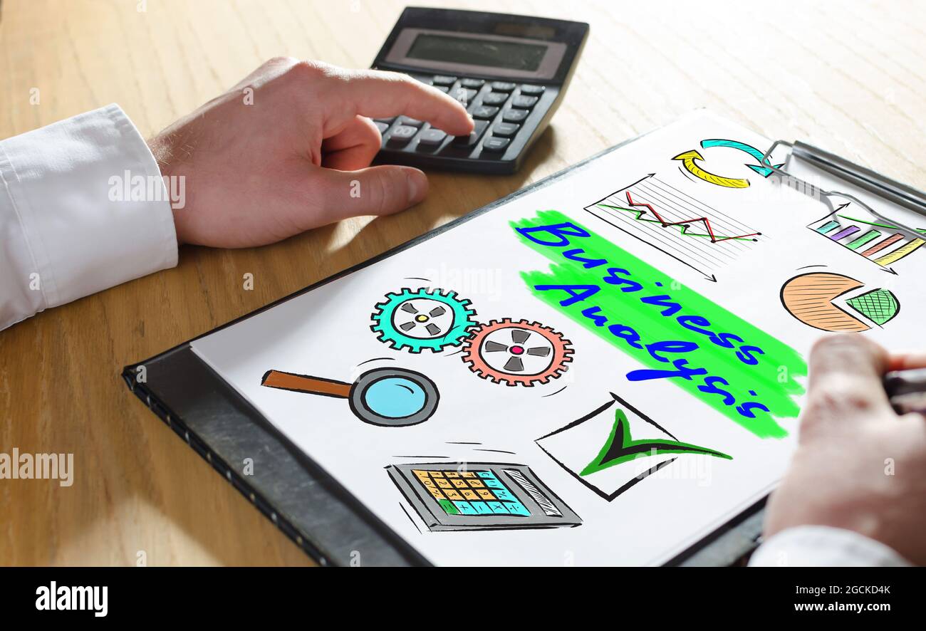 Business analysis concept with hand using a calculator Stock Photo - Alamy