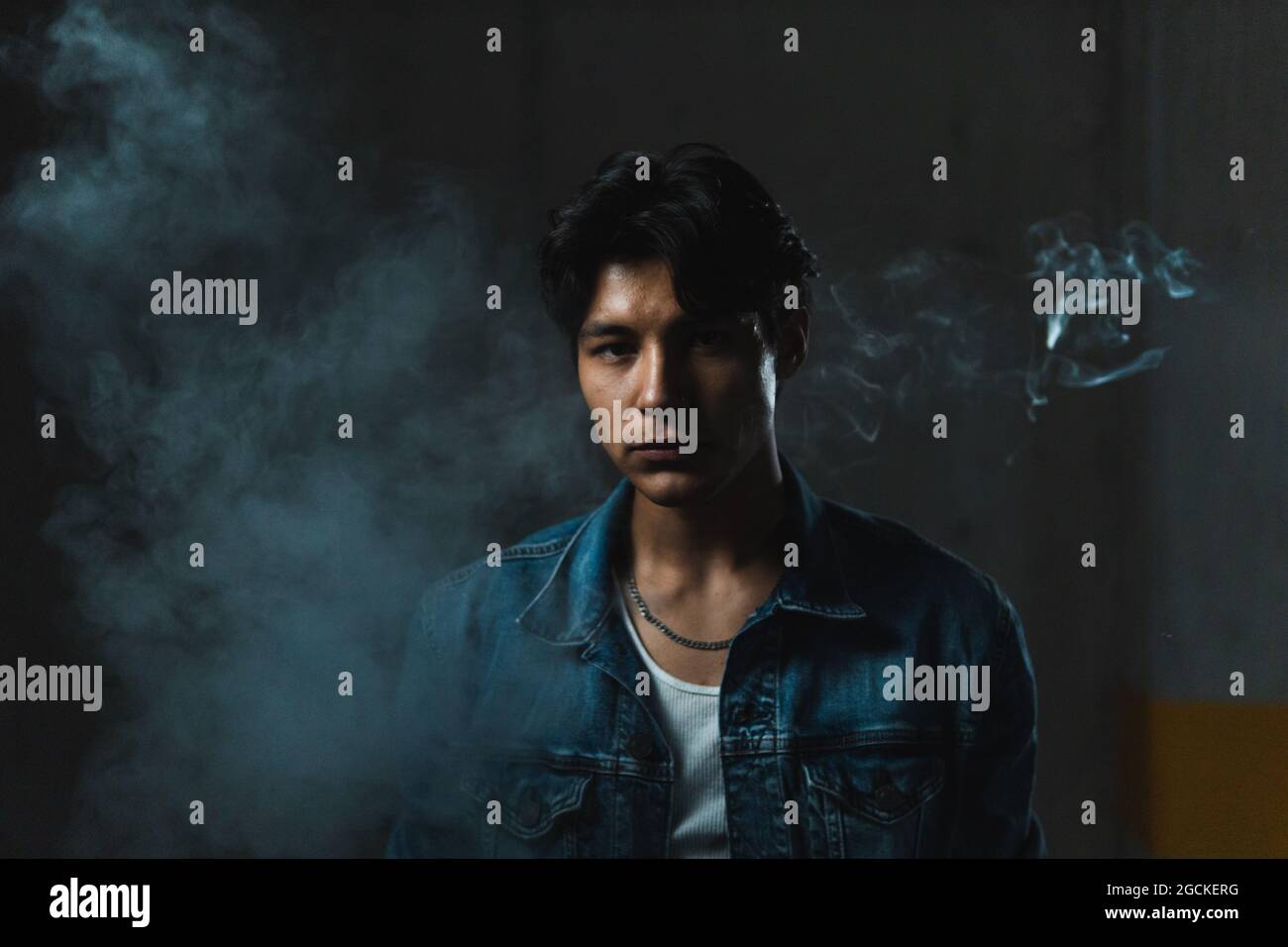 Looking at camera dramatic lighting hi-res stock photography and images ...