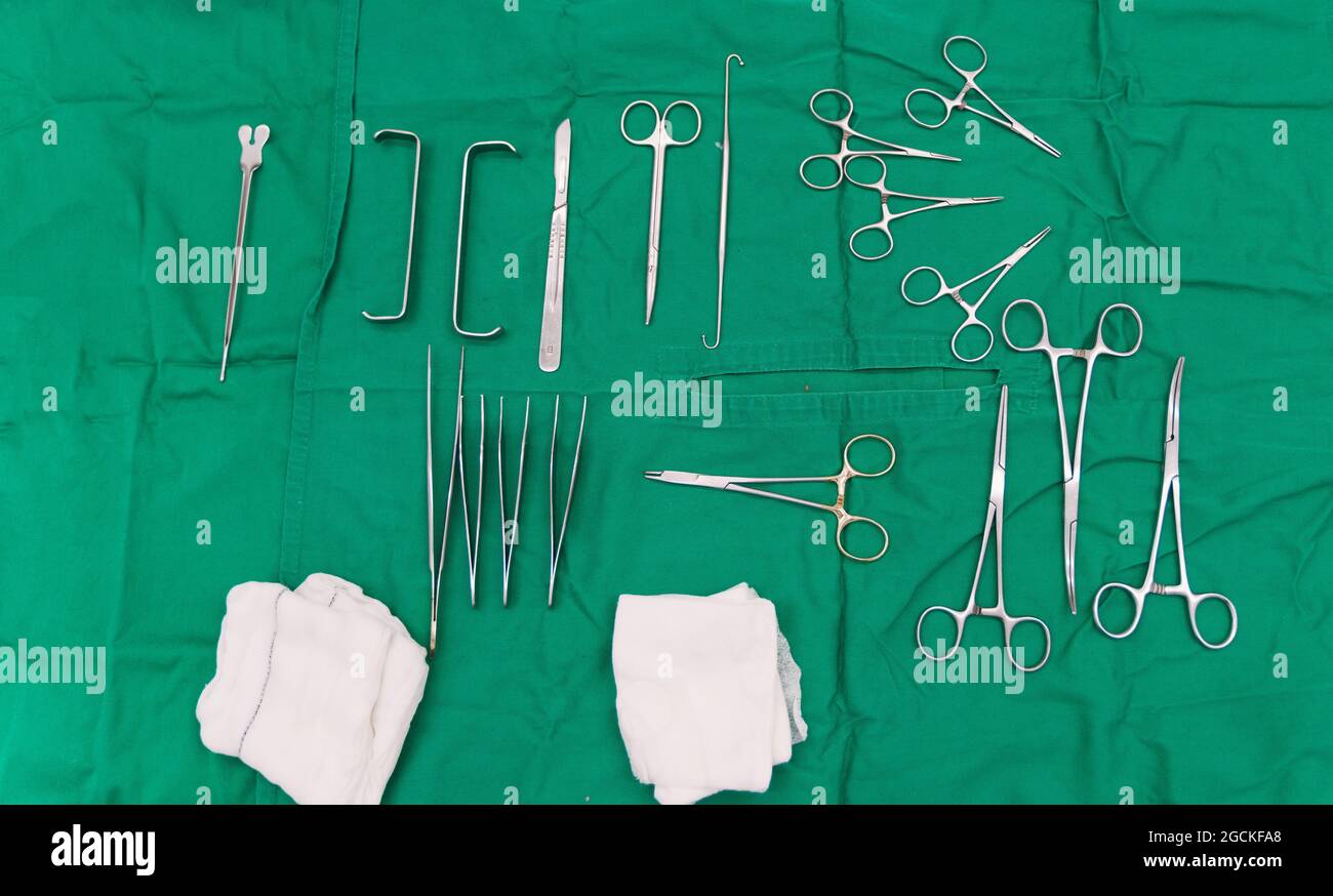 Top view of various professional surgical supplies including scissors ...