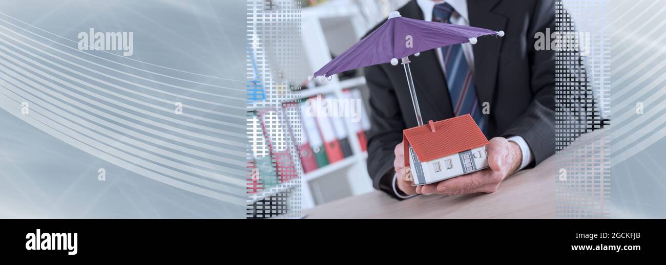 General agent protecting a house, panoramic banner Stock Photo - Alamy