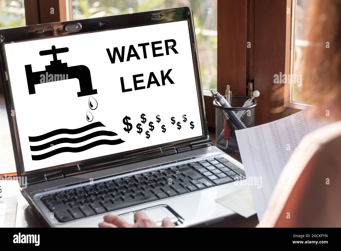 Laptop screen showing water leak concept Stock Photo - Alamy