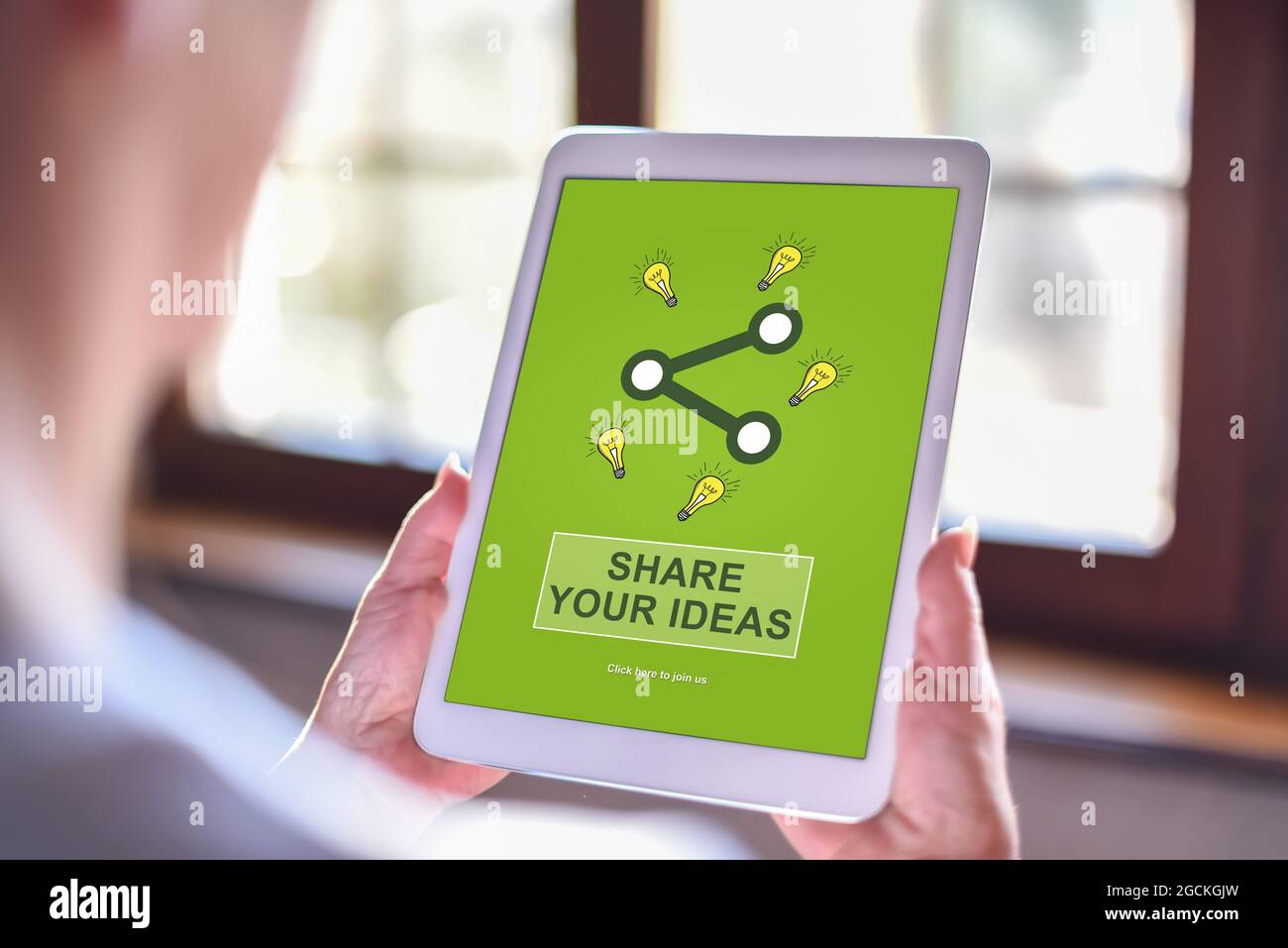 Tablet screen displaying an ideas sharing concept Stock Photo - Alamy