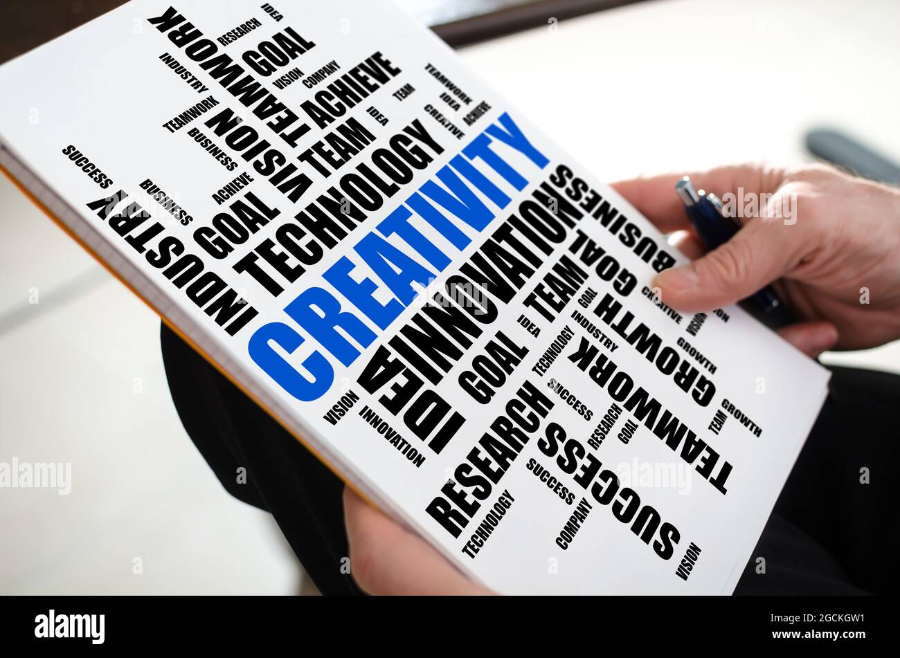 Creativity word cloud concept on a paper held by a hand Stock Photo - Alamy