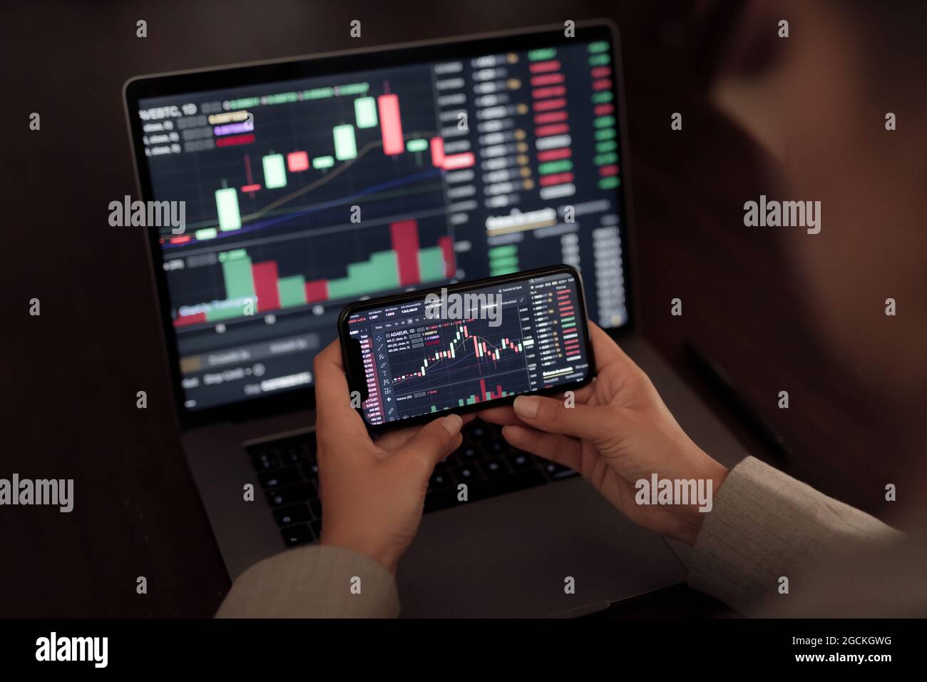 Faceless crop broker using mobile phone while working with financial ...