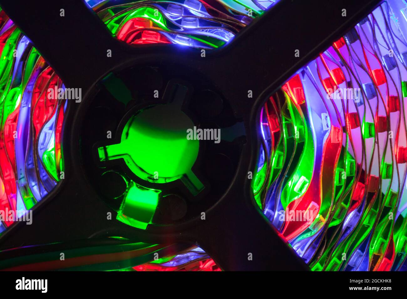 Rolled LED strip lights glow in the dark, close up photo with soft ...