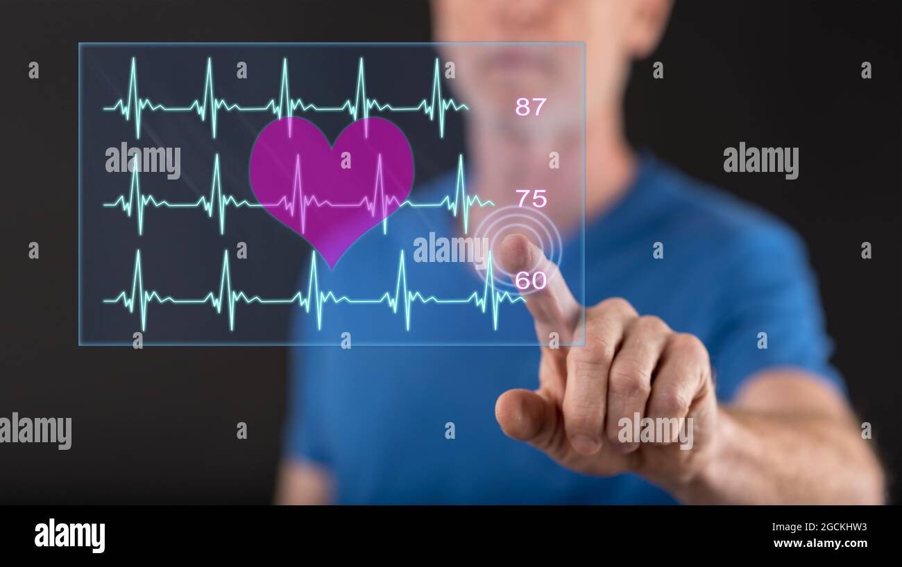 Man touching a heart beats graph concept on a touch screen with his ...