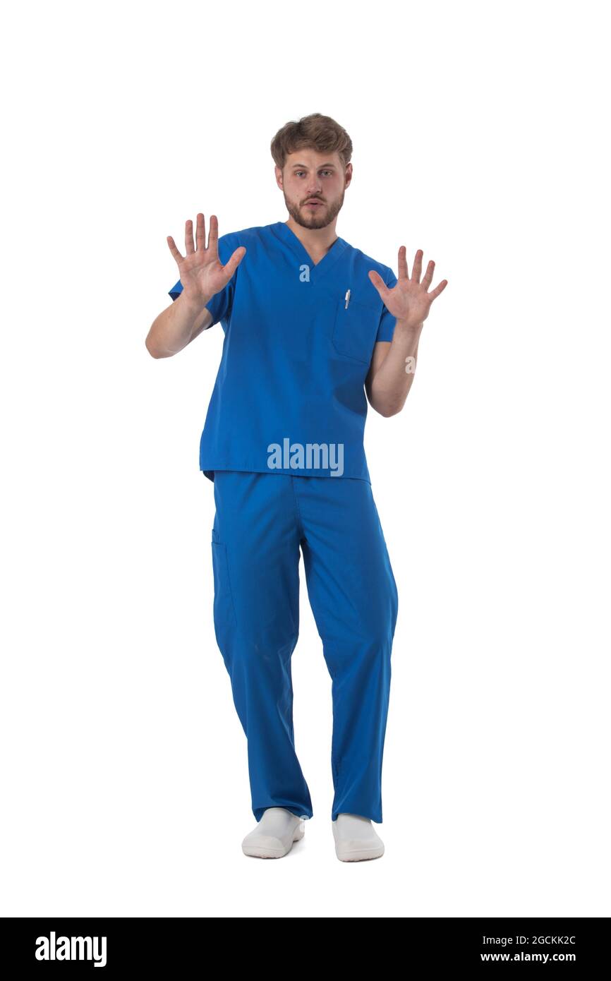 Young male medical nurse healthcare worker showing stop sign isolated ...