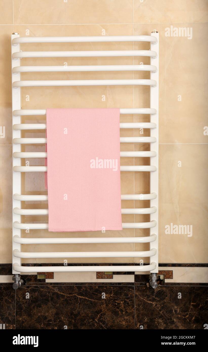 Color towel on radiator in bathroom Stock Photo - Alamy