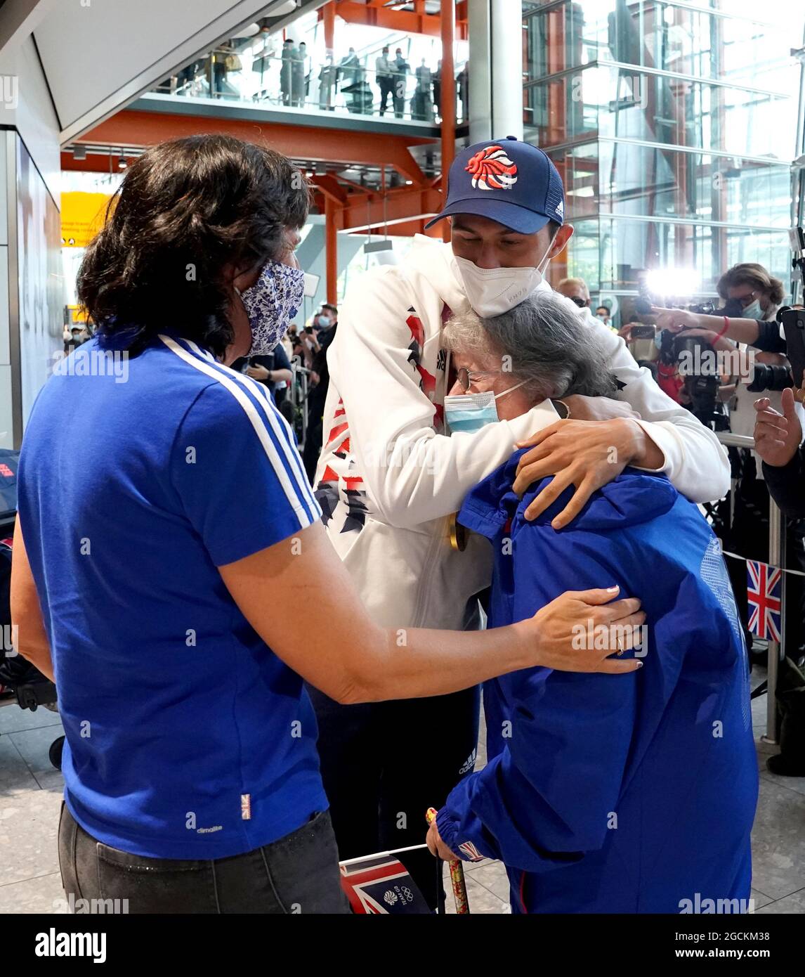 Great Britain's Joe Choong is greeted as he arrives at Heathrow Airport ...