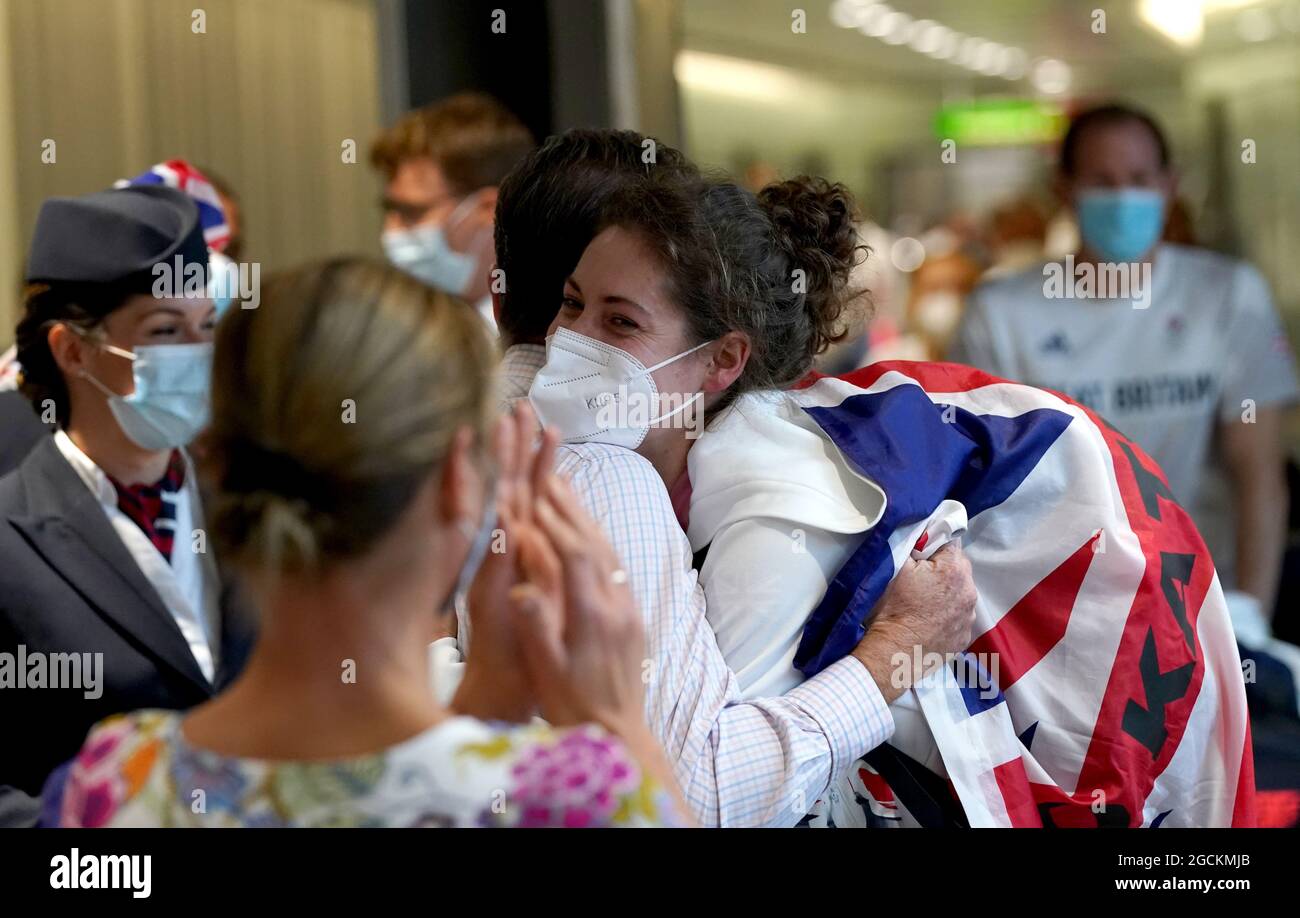 Great Britain's Kate French is greeted as she arrives at Heathrow ...