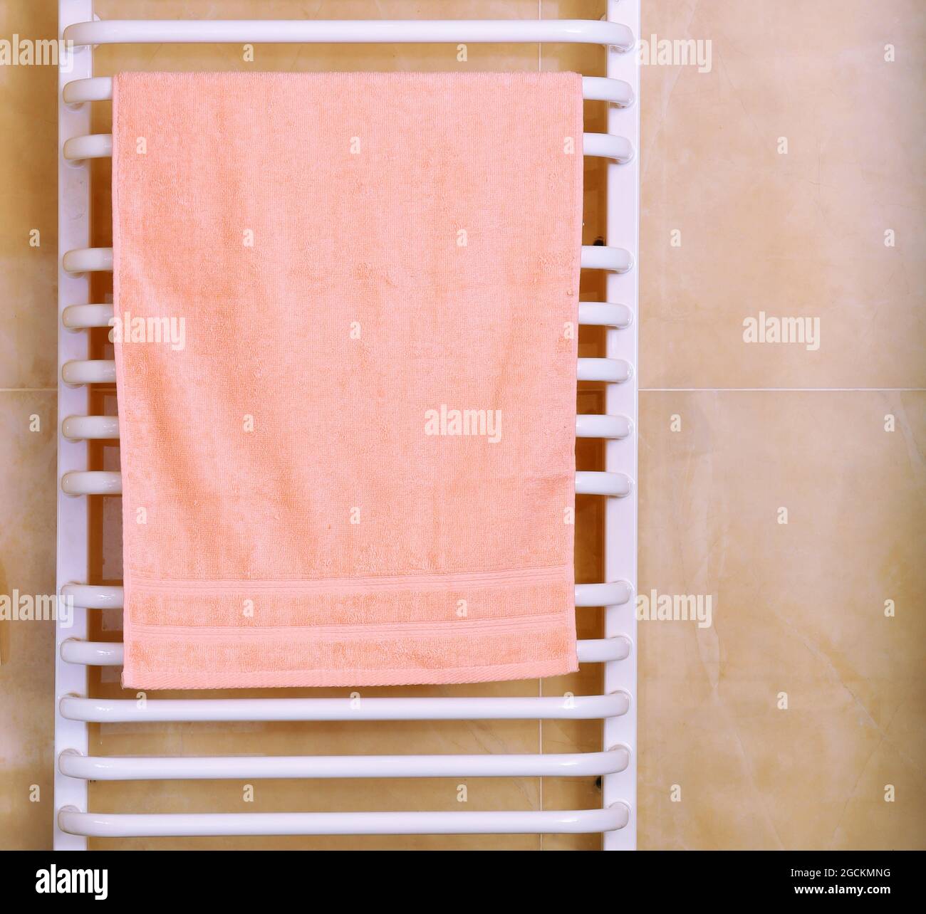 Color towel on radiator in bathroom Stock Photo - Alamy