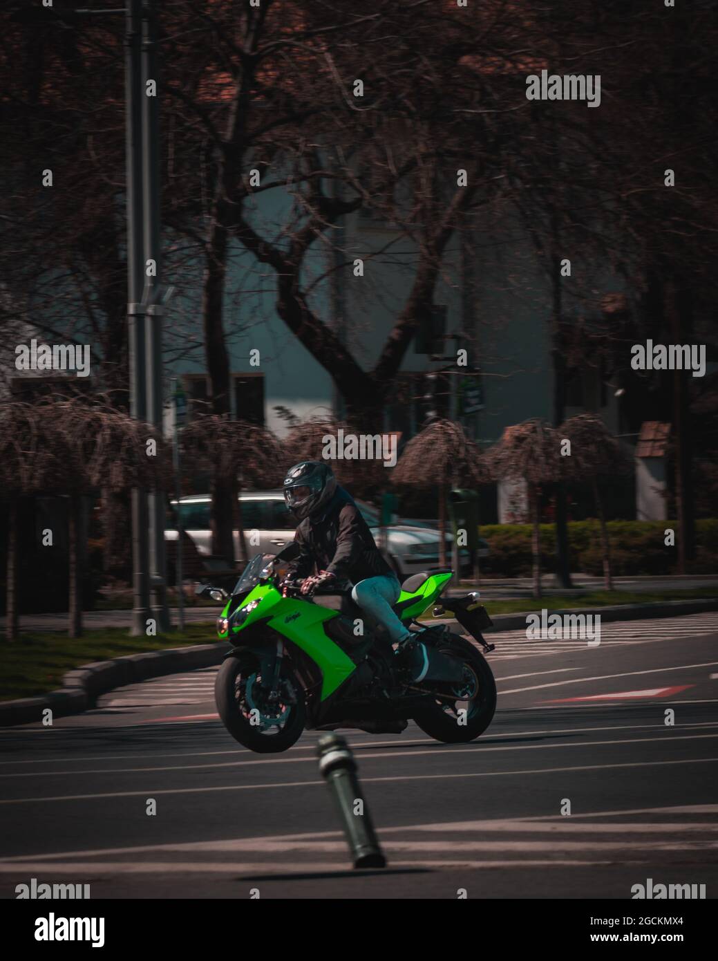 Rider speeding with his motorcycle on the road Stock Photo - Alamy
