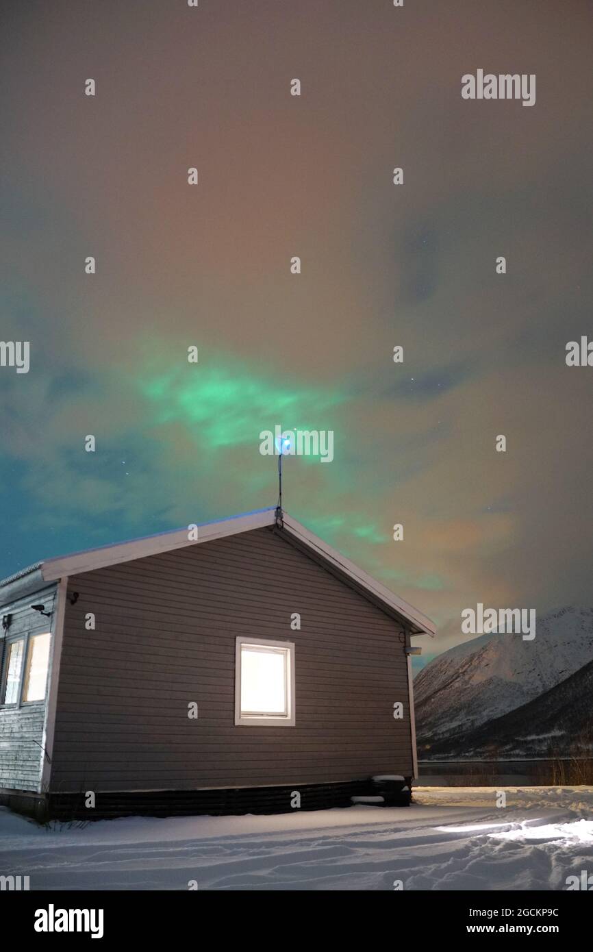 Spectacular green Northern Lights in Tromso Stock Photo - Alamy