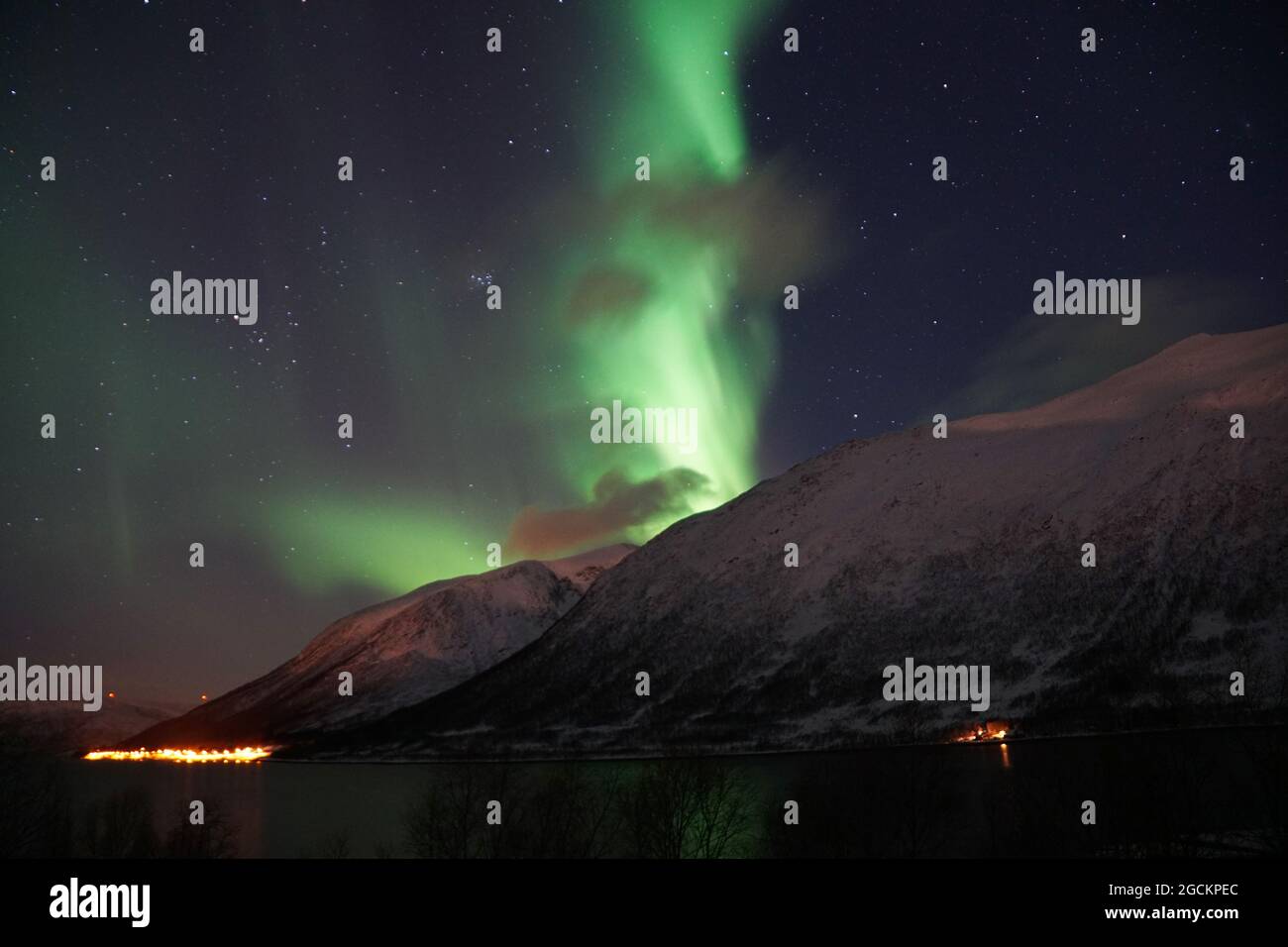 Spectacular green Northern Lights in Tromso Stock Photo - Alamy