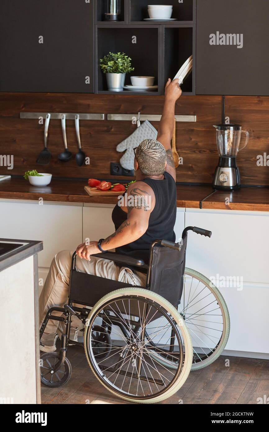 Person with disability cooking hi-res stock photography and images - Alamy