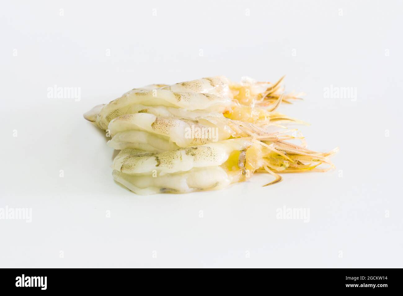 Freshness of peeled shrimp uncooked, isolated on a white macro ...