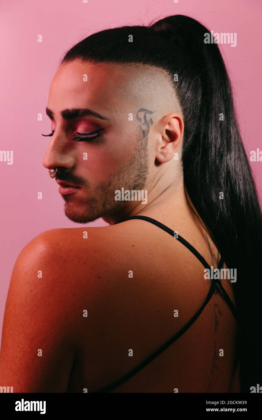 Side view portrait of glamorous transgender bearded Woman in ...