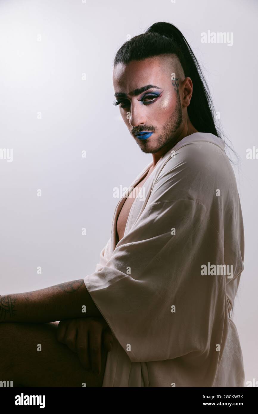 Portrait of glamorous transgender bearded Woman in sophisticated make ...