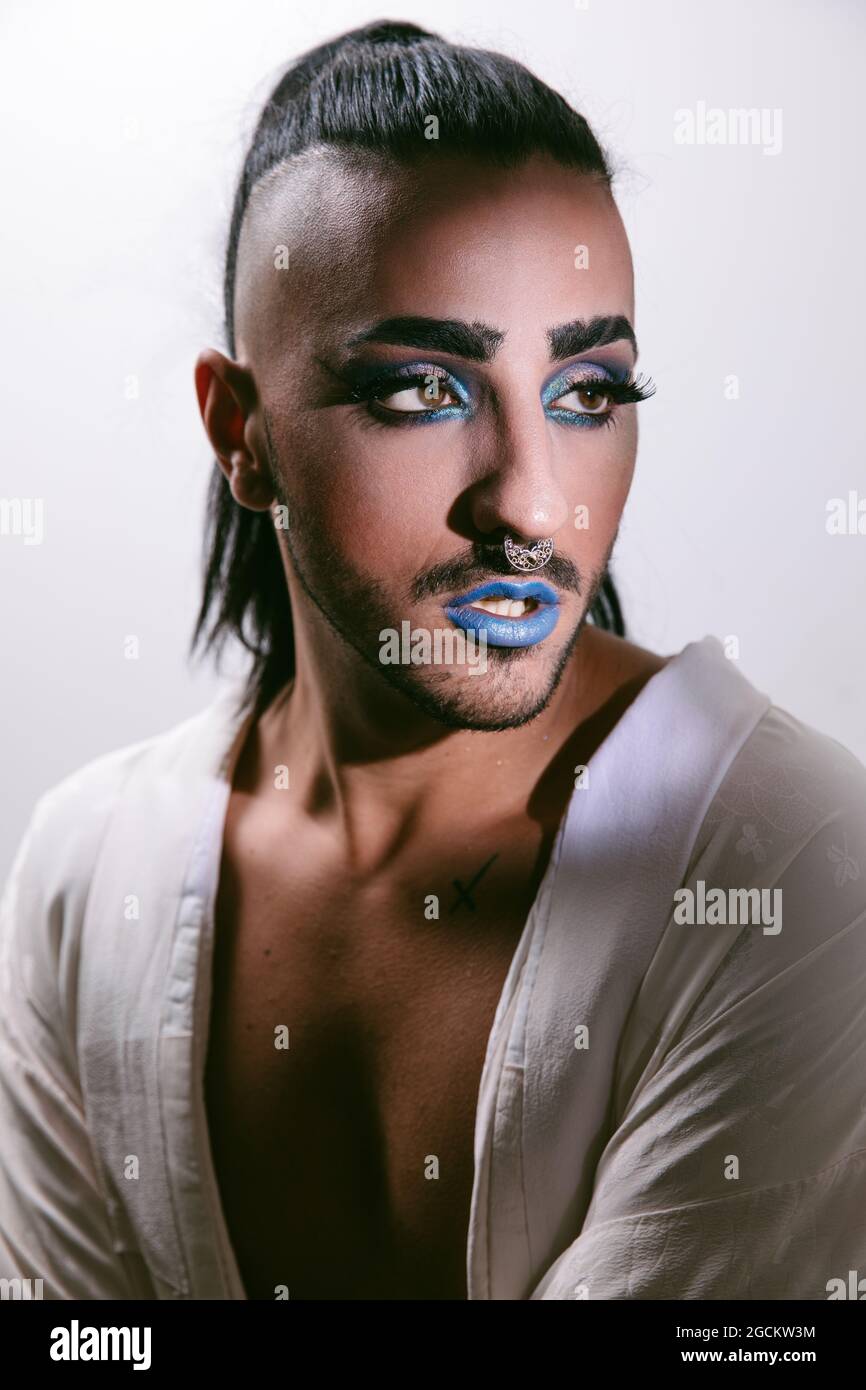 Portrait of glamorous transgender bearded Woman in sophisticated make ...