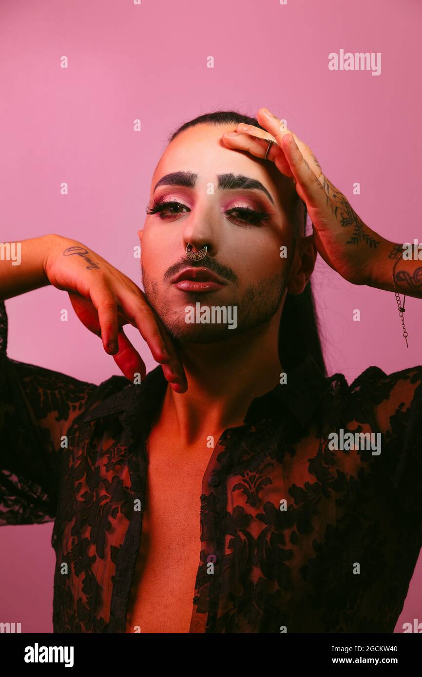 Portrait of glamorous transgender bearded Woman in sophisticated make ...