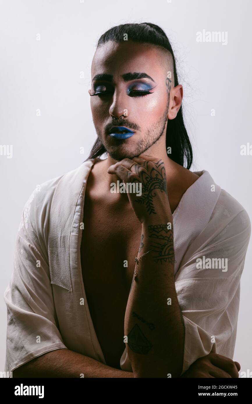 Portrait of glamorous transgender bearded Woman in sophisticated make ...