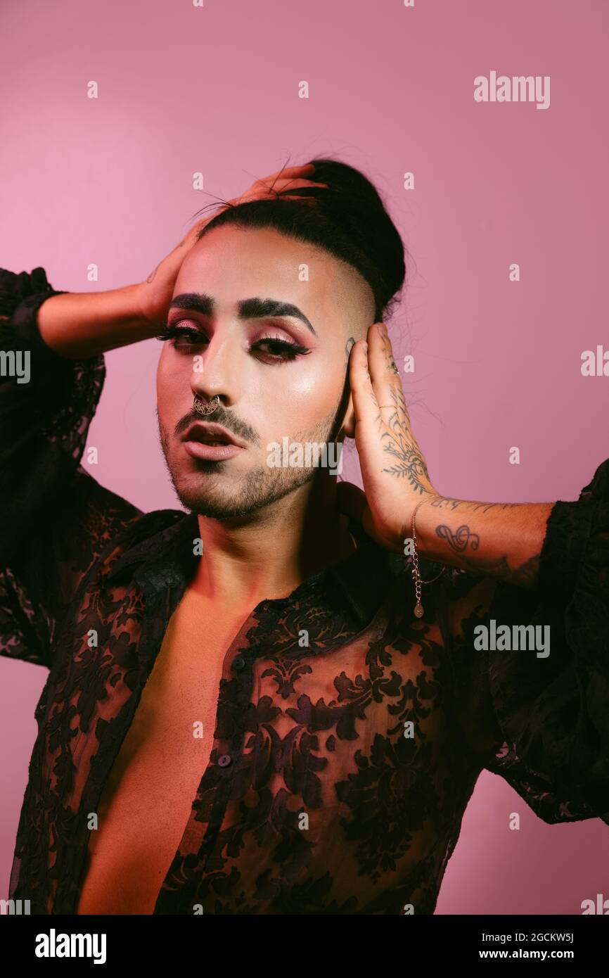 Portrait of glamorous transgender bearded Woman in sophisticated make ...